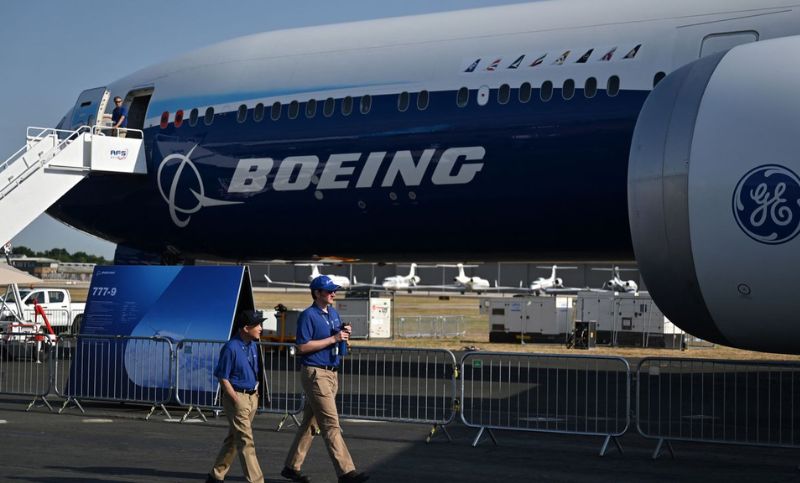 Boeing reports huge loss on defense contract woes